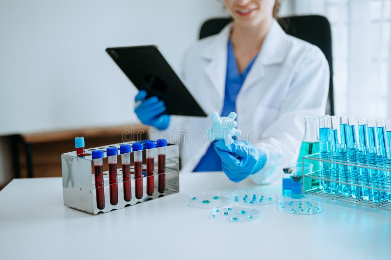 Modern Medical Research Laboratory. Female Scientist Working with Micro ...