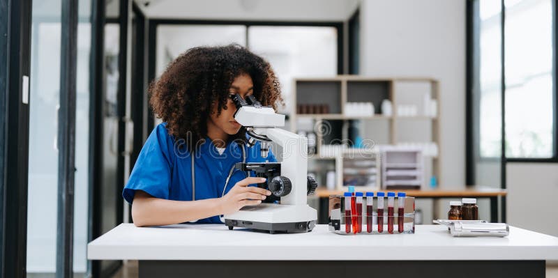 Modern Medical Research Laboratory. Female Scientist Working with Micro ...