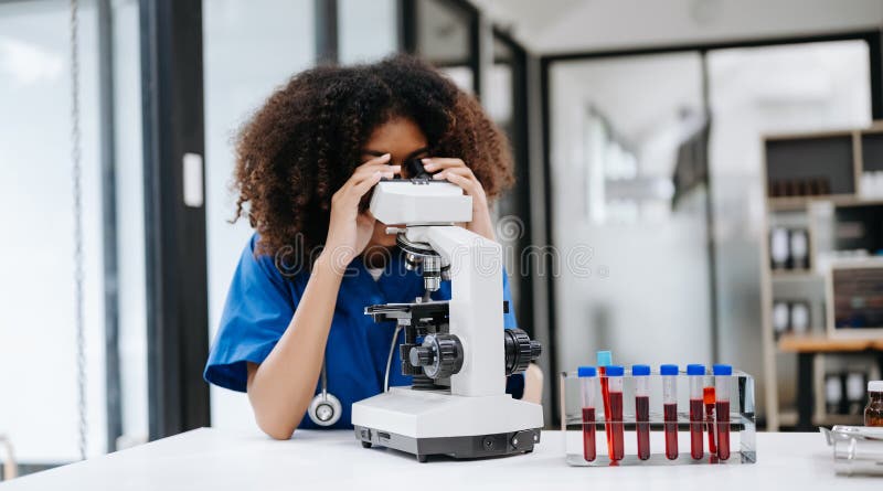 Modern Medical Research Laboratory. Female Scientist Working with Micro ...