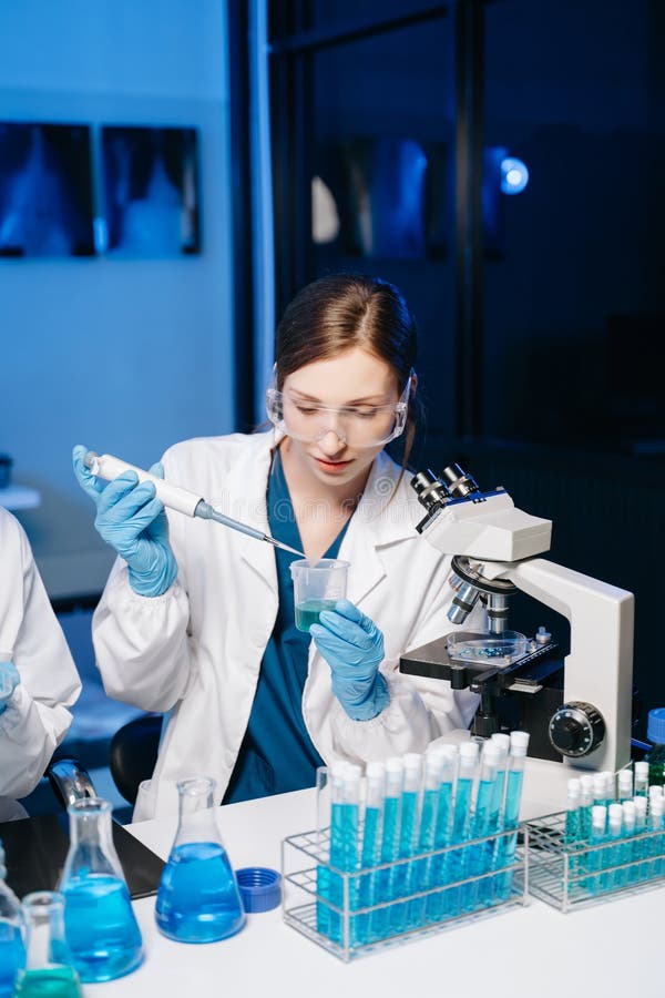 Modern Medical Research Laboratory. Female Scientist Working with Micro ...