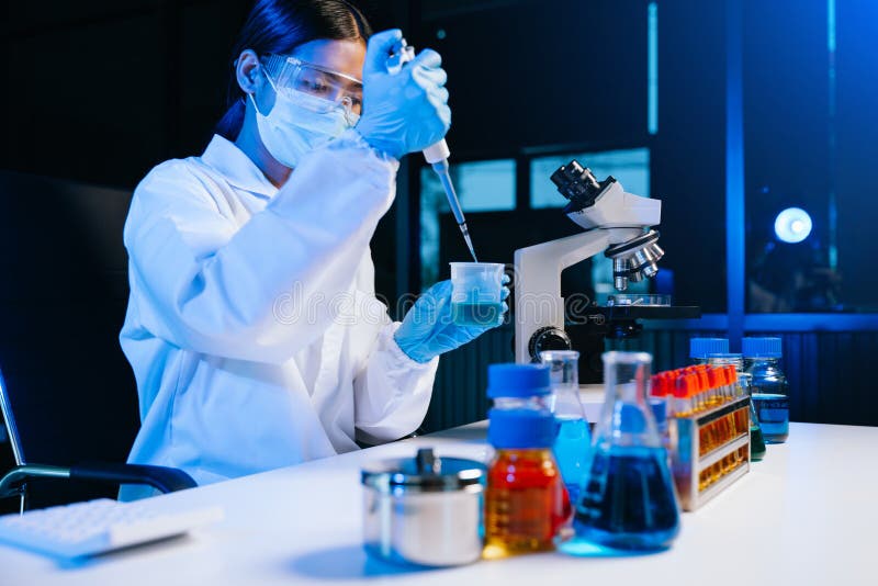 Modern Medical Research Laboratory. Female Scientist Working with Micro ...