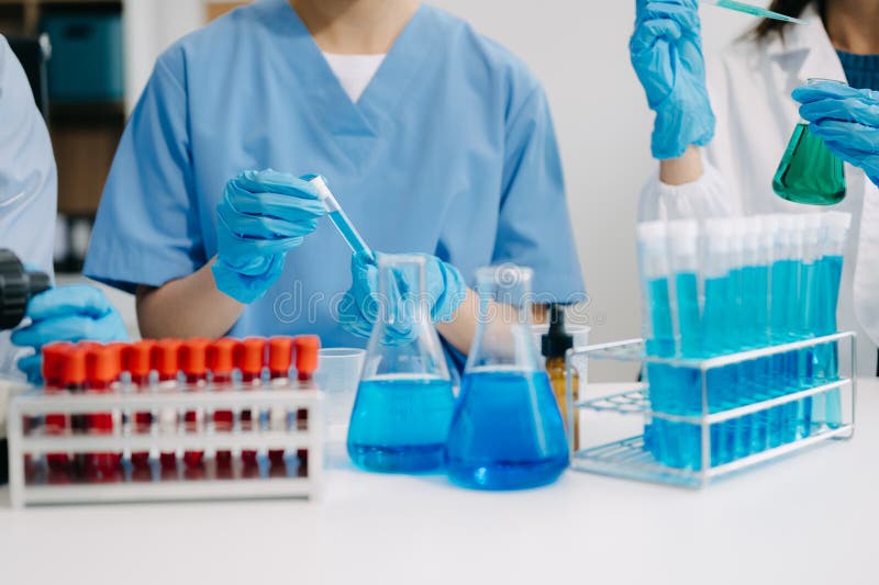 Modern Medical Research Laboratory Portrait of Team Scientists Working ...
