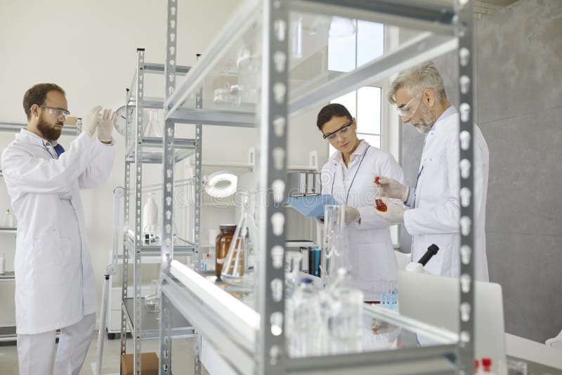 Group of Scientists Analyzing Test Sample Conducting Chemical ...