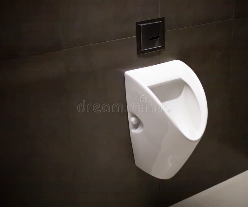 Modern Men`s Urinal on Black Ceramic Tile, Copy Space, Hygiene Stock ...