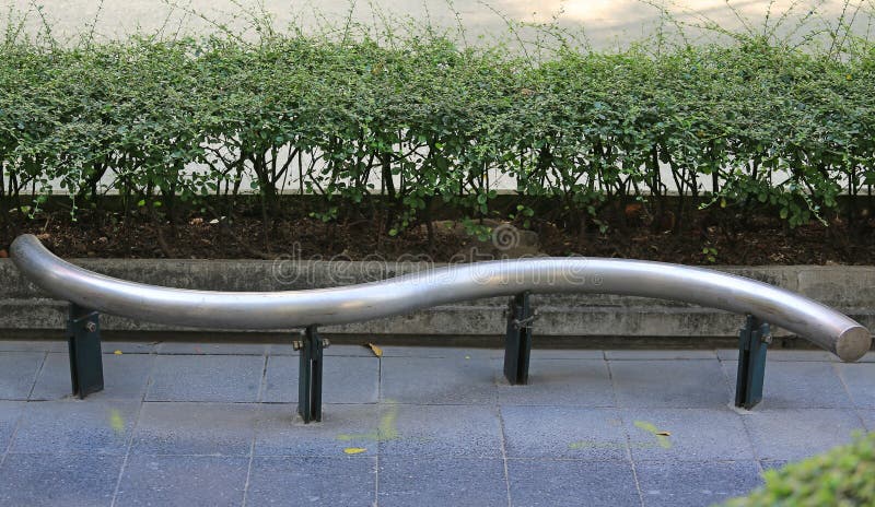 Modern Metal Bench at Bus Stop Against Leaf Wall Stock Photo - Image of ...