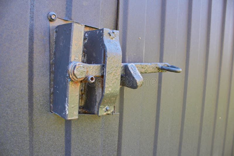 Retro Handle on the Gate, Modern Metal Fence with a Gate and an Antique ...
