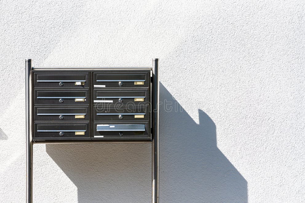 Modern Metal Mailbox Structure Against a Clean Wall Stock Image - Image ...