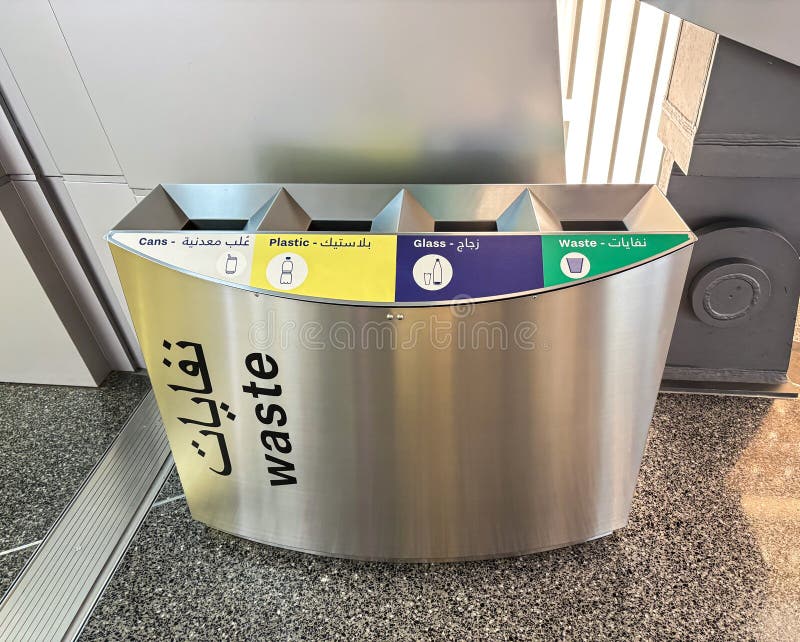 A Modern, Metallic Recycling Bin with Compartments for Different Types ...