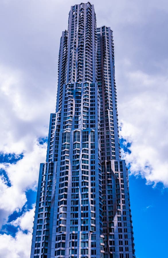 Modern Metallic Shiny Skyscraper with Wavy Shape Facade and Cloudy Blue ...