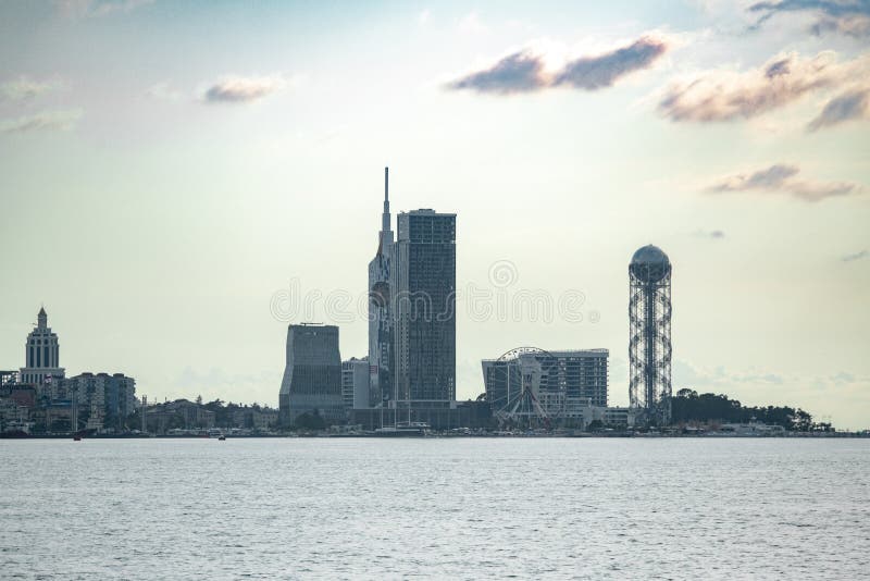 Modern Metropolis on the Background of the Sea and Beautiful Clouds on ...