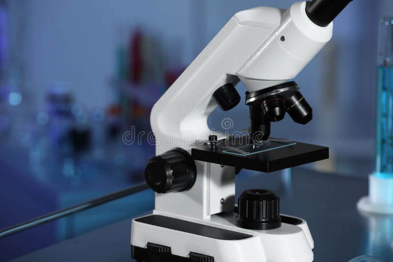 Modern Microscope with Glass Slide on Metal Table in Laboratory, Toned ...