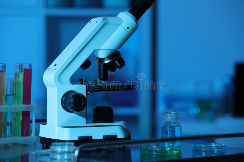 Modern Microscope with Glass Slide on Metal Table in Laboratory, Toned ...