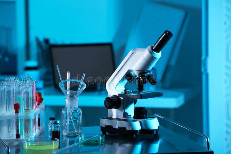Modern Microscope with Glass Slide on Metal Table in Laboratory, Toned ...