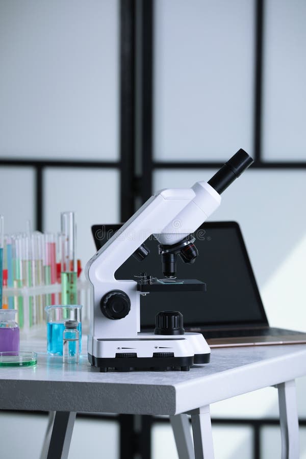 Modern Microscope with Glass Slide on White Table in Laboratory Stock ...