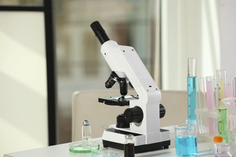 Modern Microscope with Glass Slide on White Table in Laboratory, Space ...