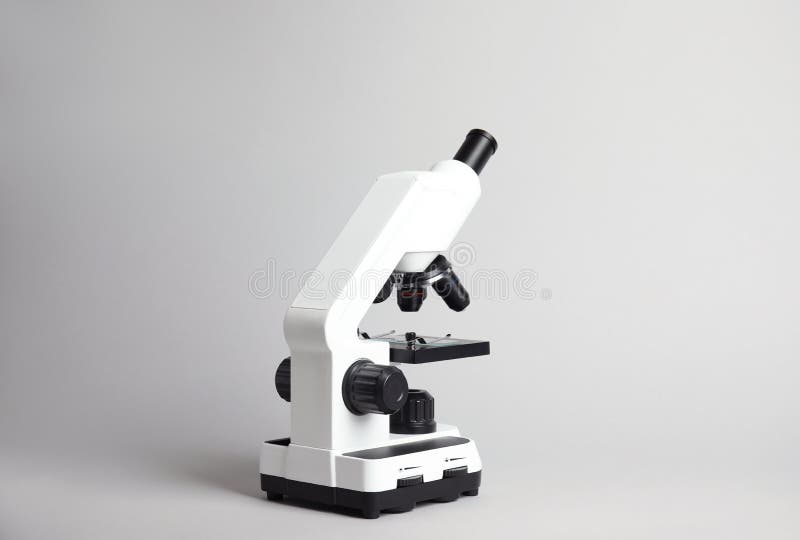 Modern Microscope with Different Lenses, Space for Text. Medical ...