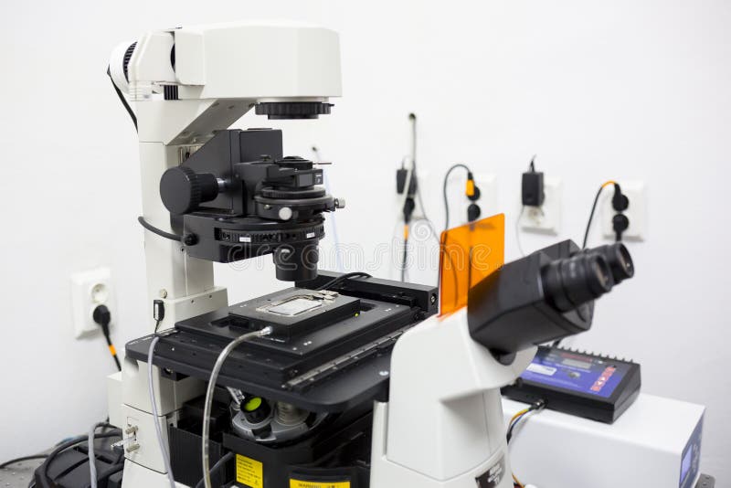Modern Microscope with Different Lenses, Space for Text. Medical ...