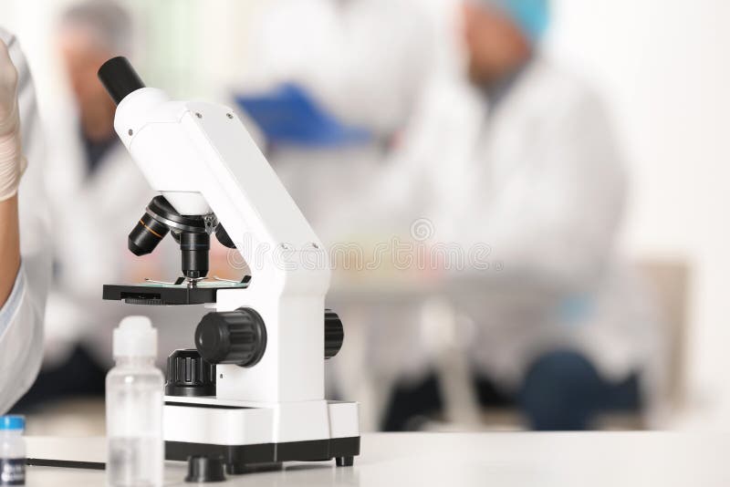 Modern Microscope on Table in Laboratory, Space for Text Stock Photo ...