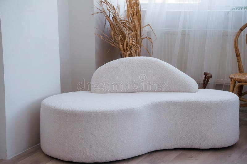 Modern Minimalist White Sofa with Organic Shapes in a Bright Interior ...