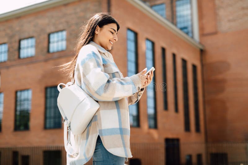 Modern Mobile Communication. Smiling Lady Using Smartphone Outdoors ...
