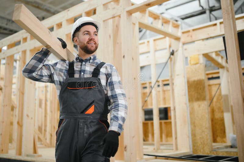 Modern Modular House. a Worker Works on the Construction of a Wooden ...