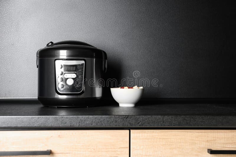Modern Multi Cooker and Ingredients on Table in Kitchen Stock Image ...