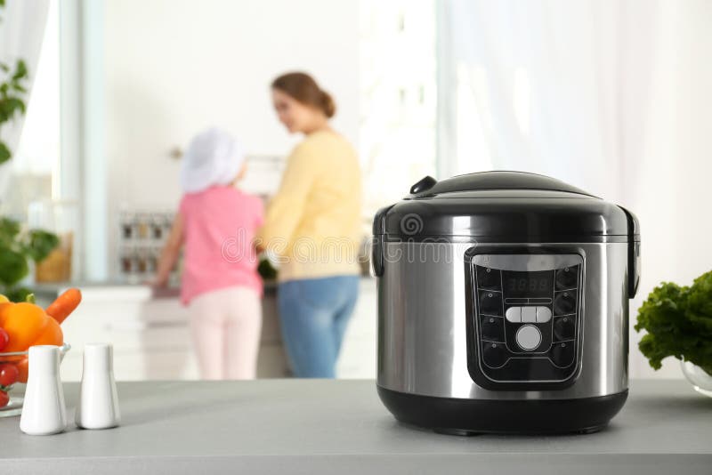 Modern Multi Cooker and Products on Table Stock Photo - Image of ...