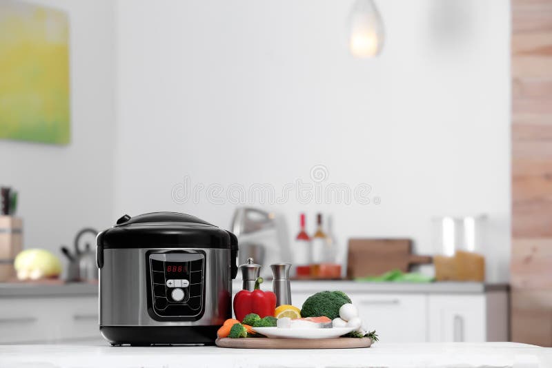 Modern Multi Cooker and Products on Table in Kitchen Stock Image ...