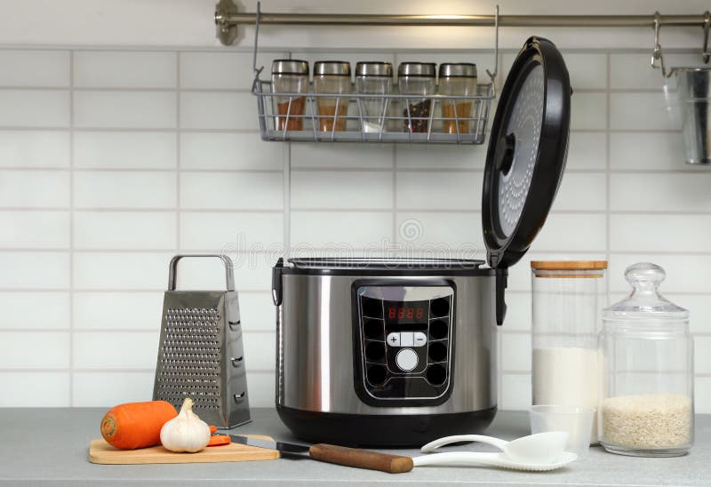 Modern Multi Cooker and Products on Table. Space for Text Stock Image ...