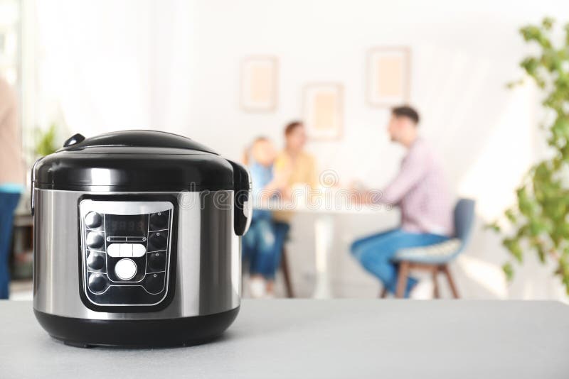 Modern Multi Cooker on Table Stock Image - Image of meal, adult: 141600575