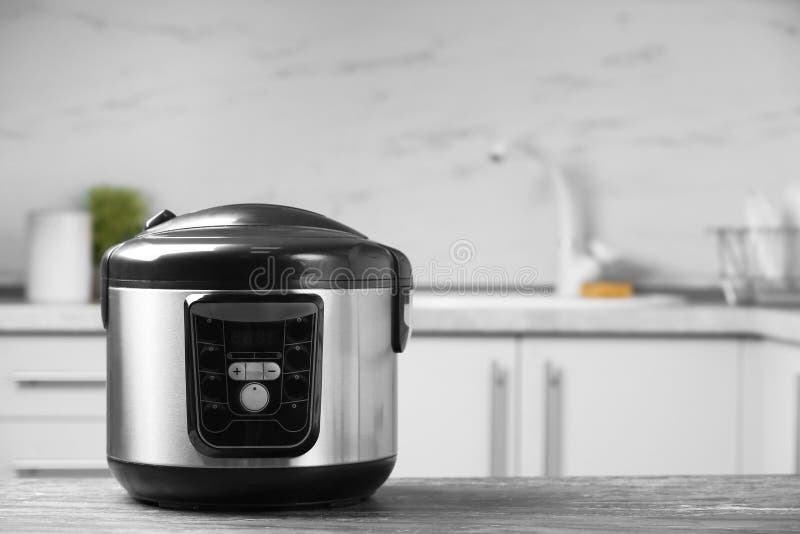 Modern Multi Cooker on Table in Kitchen. Stock Image - Image of ...