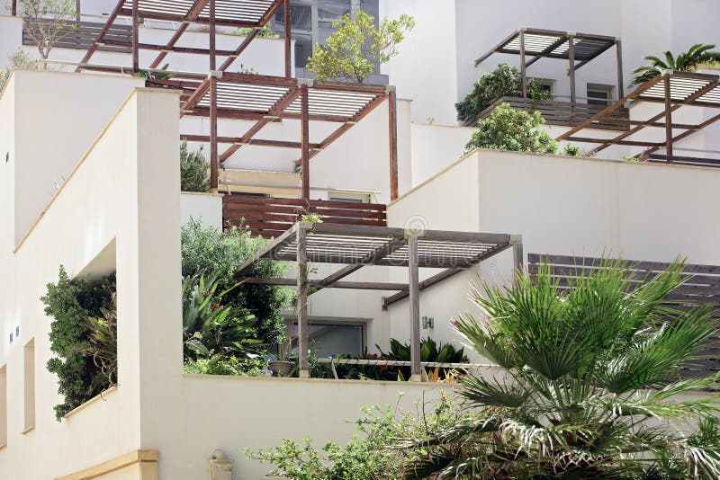 Modern Terraced Architecture with Wooden Pergolas and Greenery Stock ...
