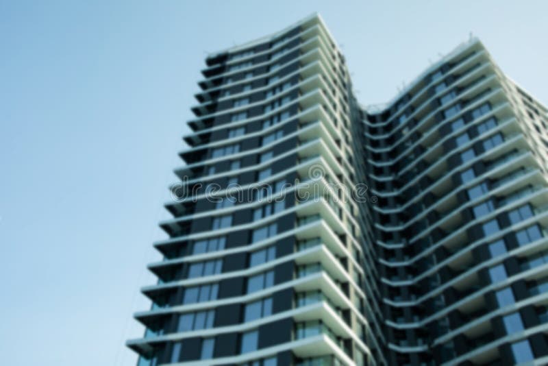 Modern Multi-storey Building Against Clear Blue Sky Stock Photo - Image ...