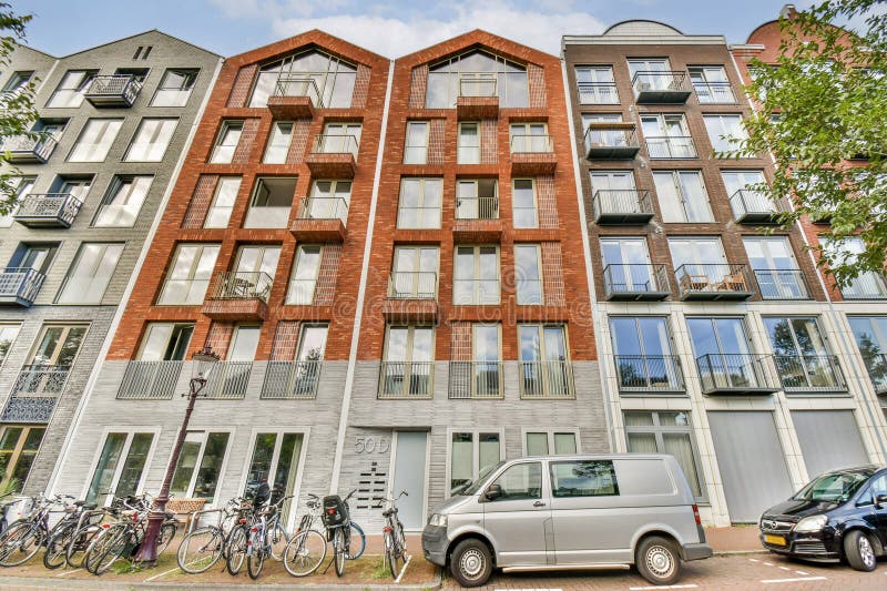 Modern Multi-Unit Residential Building with Bikes Stock Image - Image ...