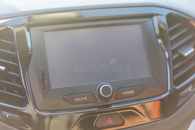 A Modern Multimedia Panel with a Screen and Control Buttons in the Car ...