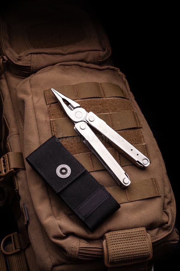 Modern Multitool with Many Tools. a Portable Multitasking Tool Lie on a ...