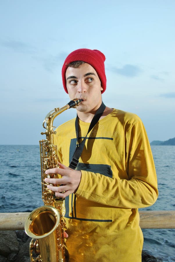 Modern Musician Posing with His Saxophone Stock Photo - Image of white ...