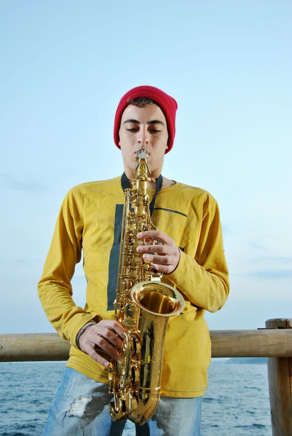 Modern Musician Posing with His Saxophone Stock Photo - Image of white ...