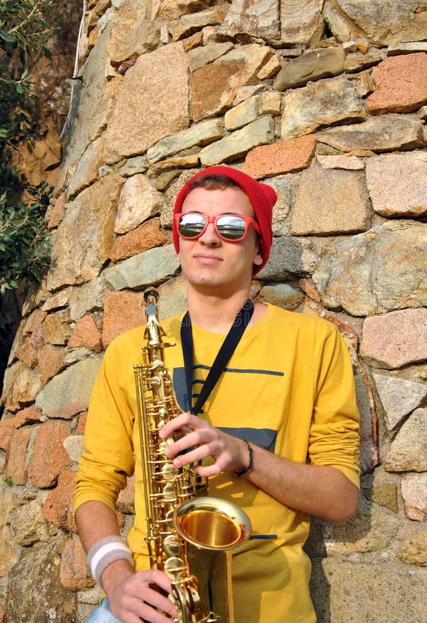 Modern Musician Posing with His Saxophone Stock Photo - Image of white ...