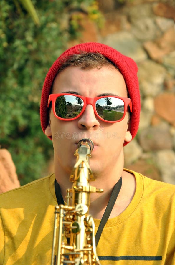 Modern Musician Posing with His Saxophone Stock Photo - Image of person ...