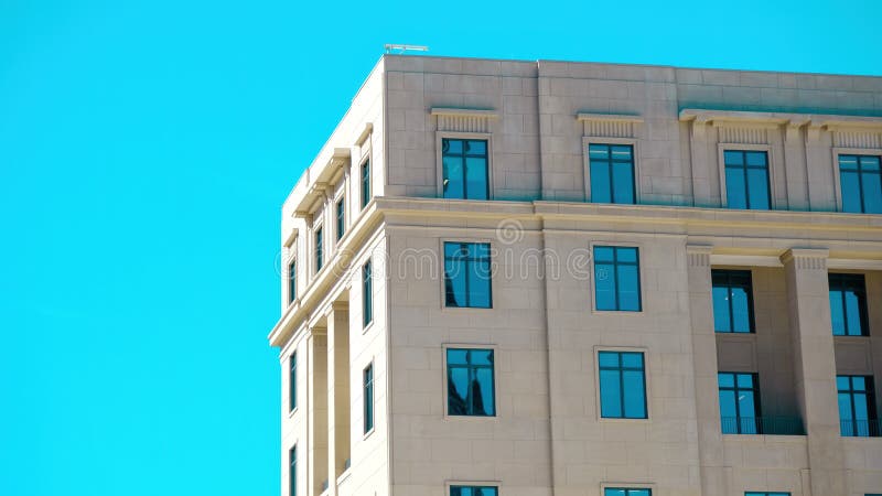 Modern Neoclassical Building with Intense Blue Sky Reflected in Windows ...