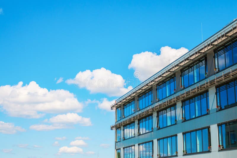 Modern Office Building Against Blue Cloudy Sky Stock Photo - Image of ...