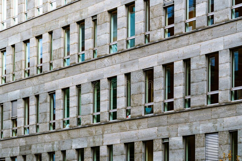 Modern Office Building Facade with Repetitive Windows and Stone ...