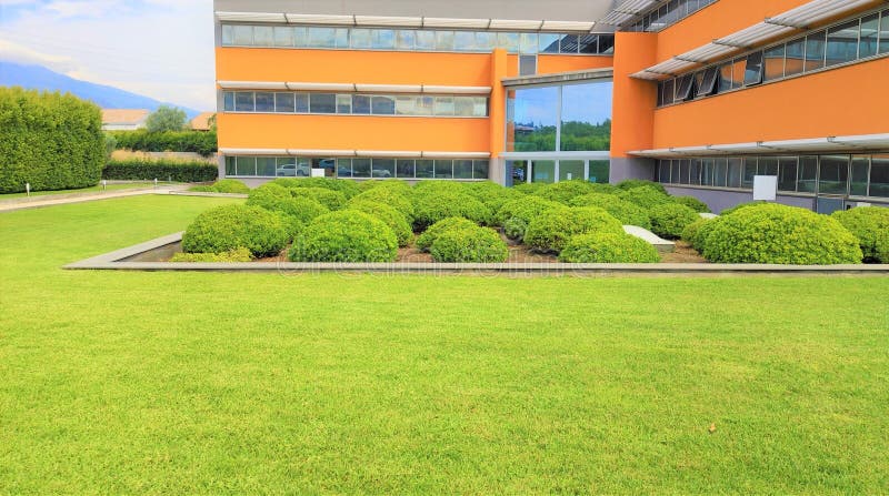 Modern Office Building with a Huge Green Grass Lawn. Very Large Front ...