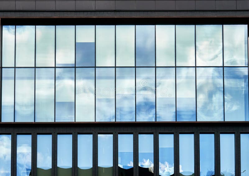 Modern Office Building with Reflection of Sky and Clouds in Windows ...