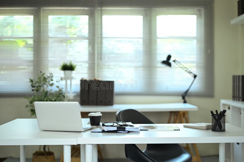 Modern Office Desk with Laptop, Coffee Cup, and Documents in Bright ...