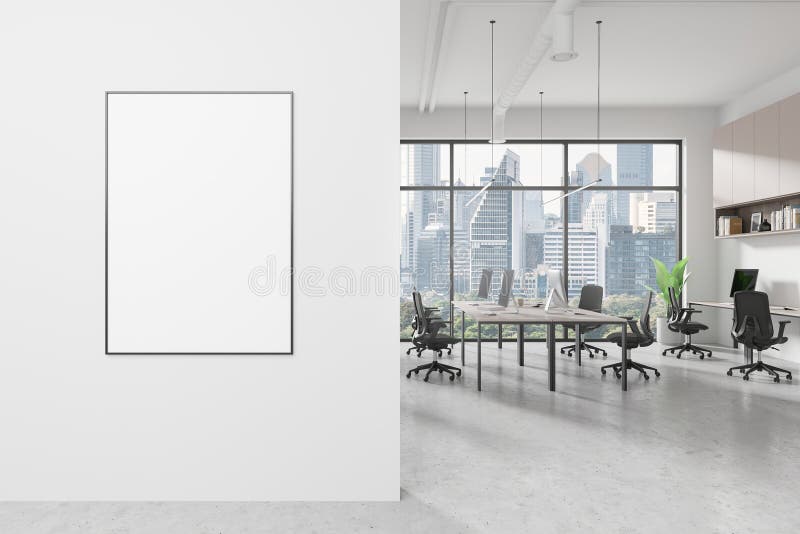 A Modern Office Interior with a Blank Poster on the Wall, Large Windows ...