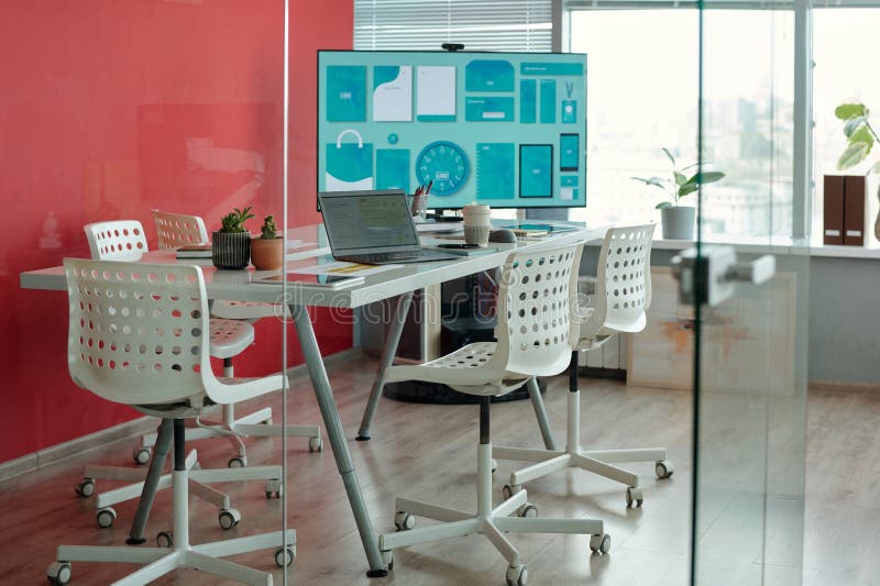 Modern Office Meeting Room with Red Wall and Tech Setup Stock Image ...