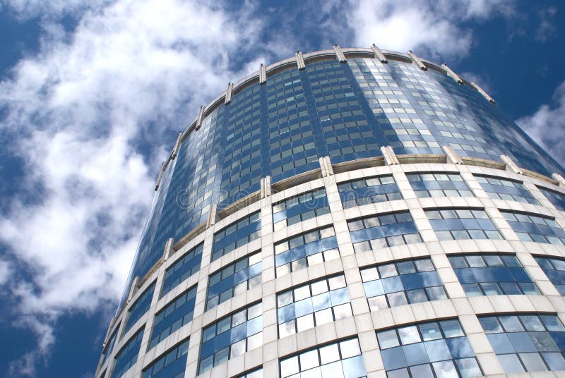 Modern Office Round Tower Building Over Cloudy Sky Stock Image - Image ...