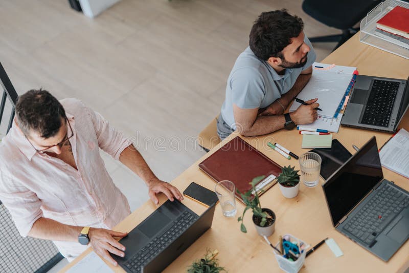 Business Employees in a Modern Multiracial Office Using Technology for ...